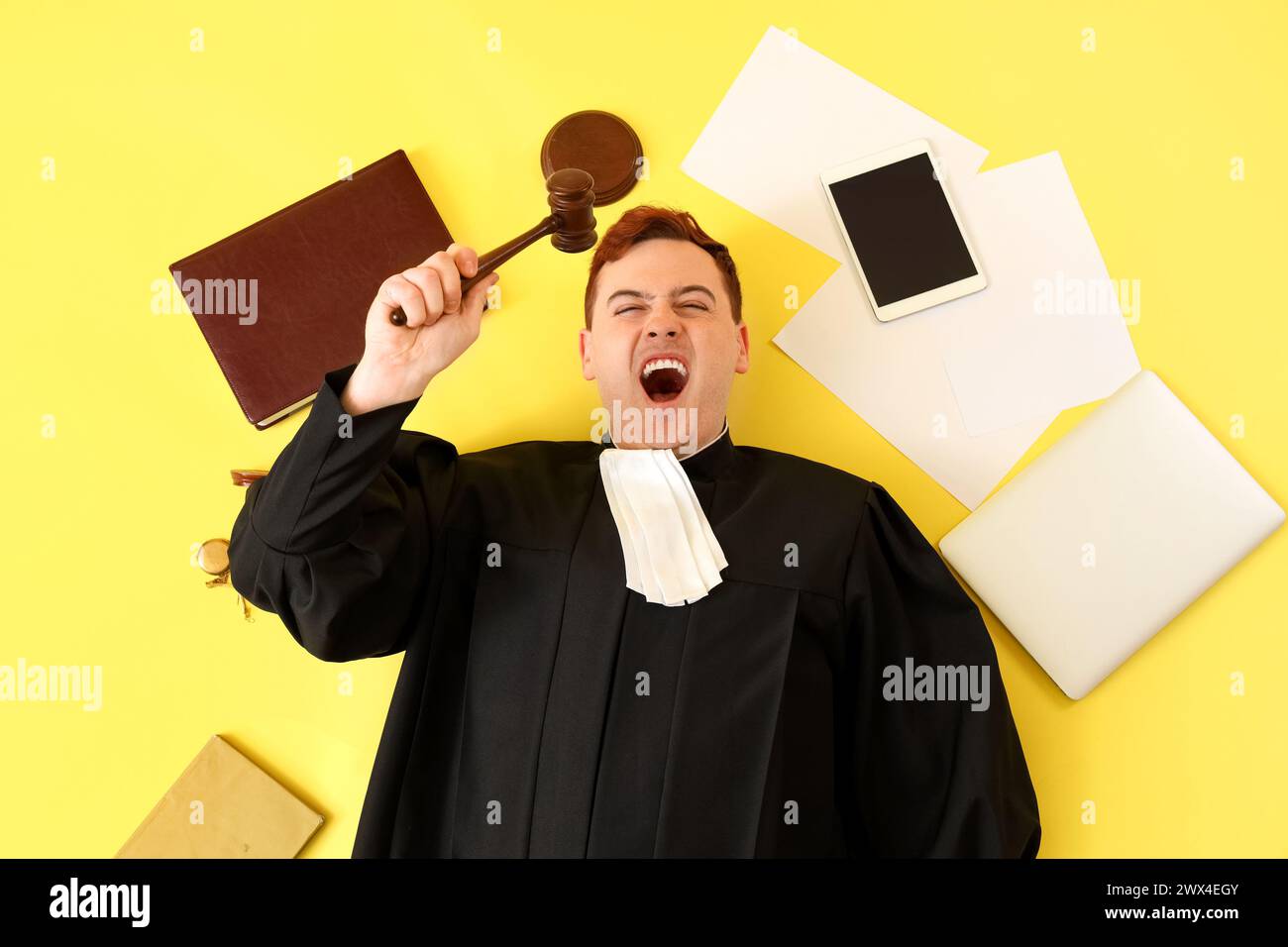Male judge with gavel and items on yellow background, top view Stock ...