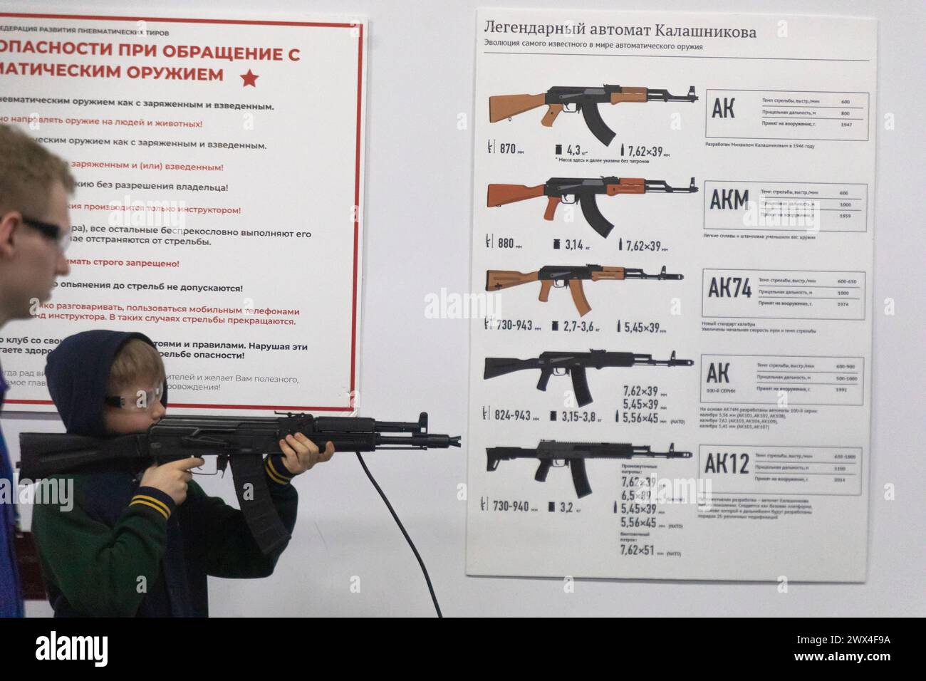 Moscow, Russia. 23rd of February, 2023. A boy shoots from a AK rifle at ...