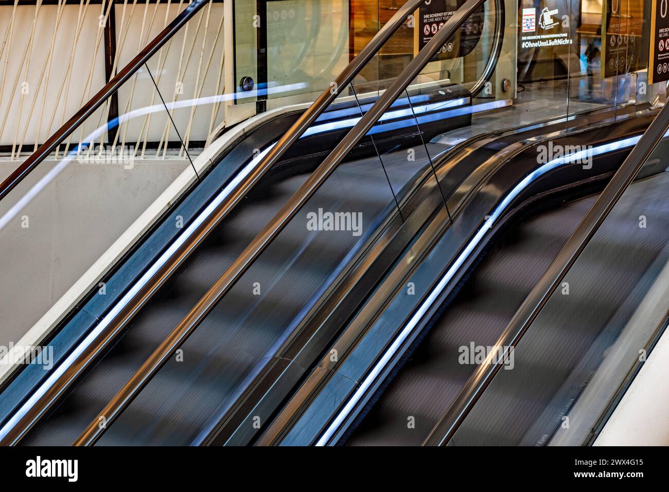 A Glass-walled escalator in a station Stock Photo - Alamy