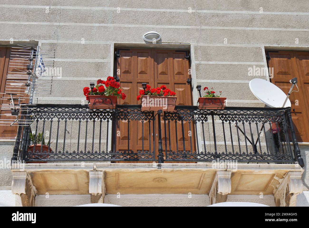 Typical Greek Balcony with Antenna, Flowers and Satellite Dish in Samos ...