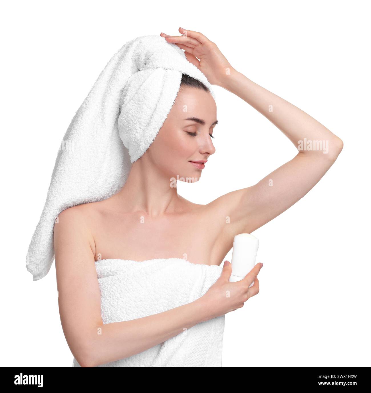 Beautiful woman applying deodorant on white background Stock Photo - Alamy
