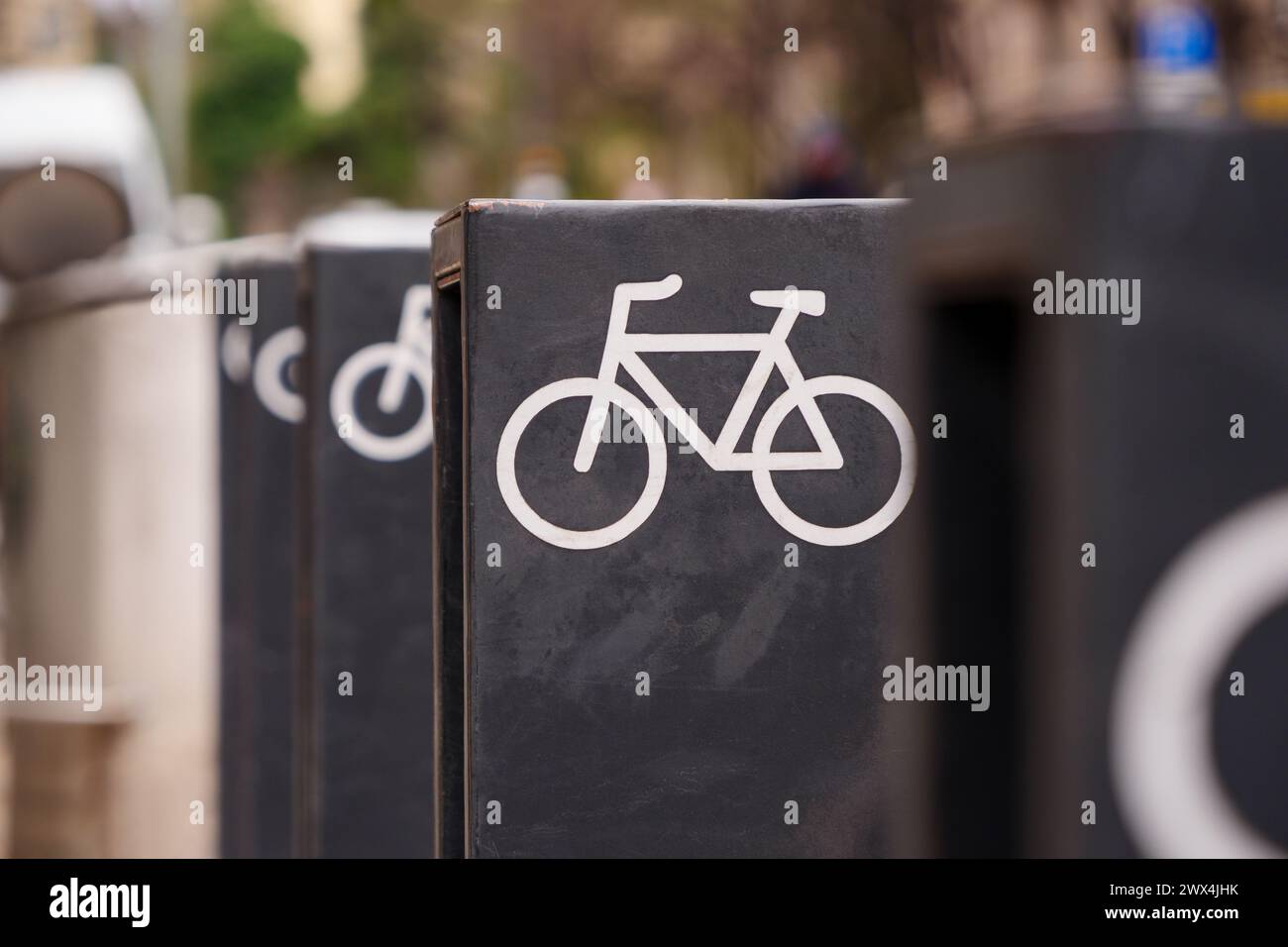 The row of bike park metal racks with bike icons, installed in the city ...