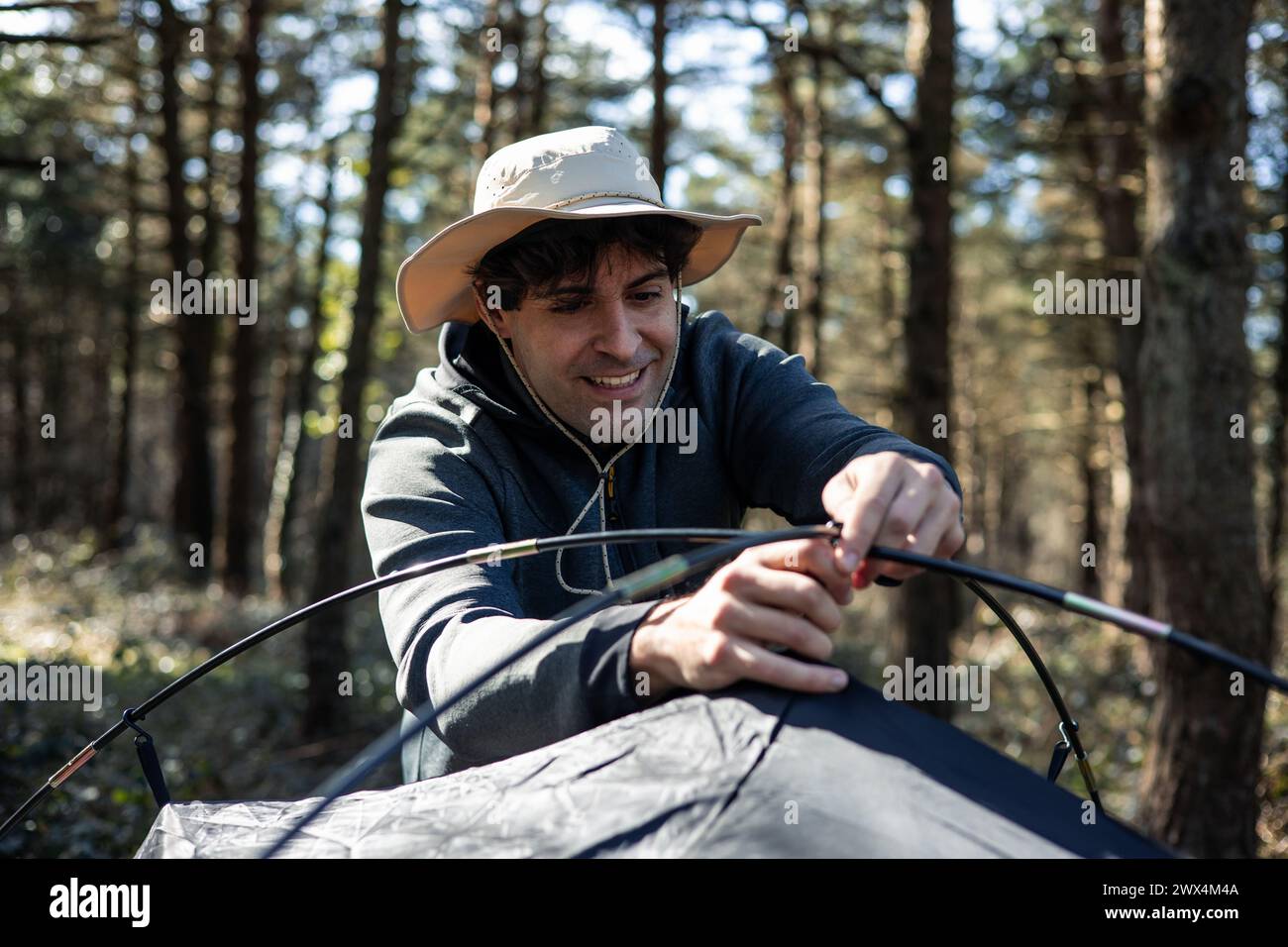 vertical portrait Closeup of a happy young man wearing a hat ...