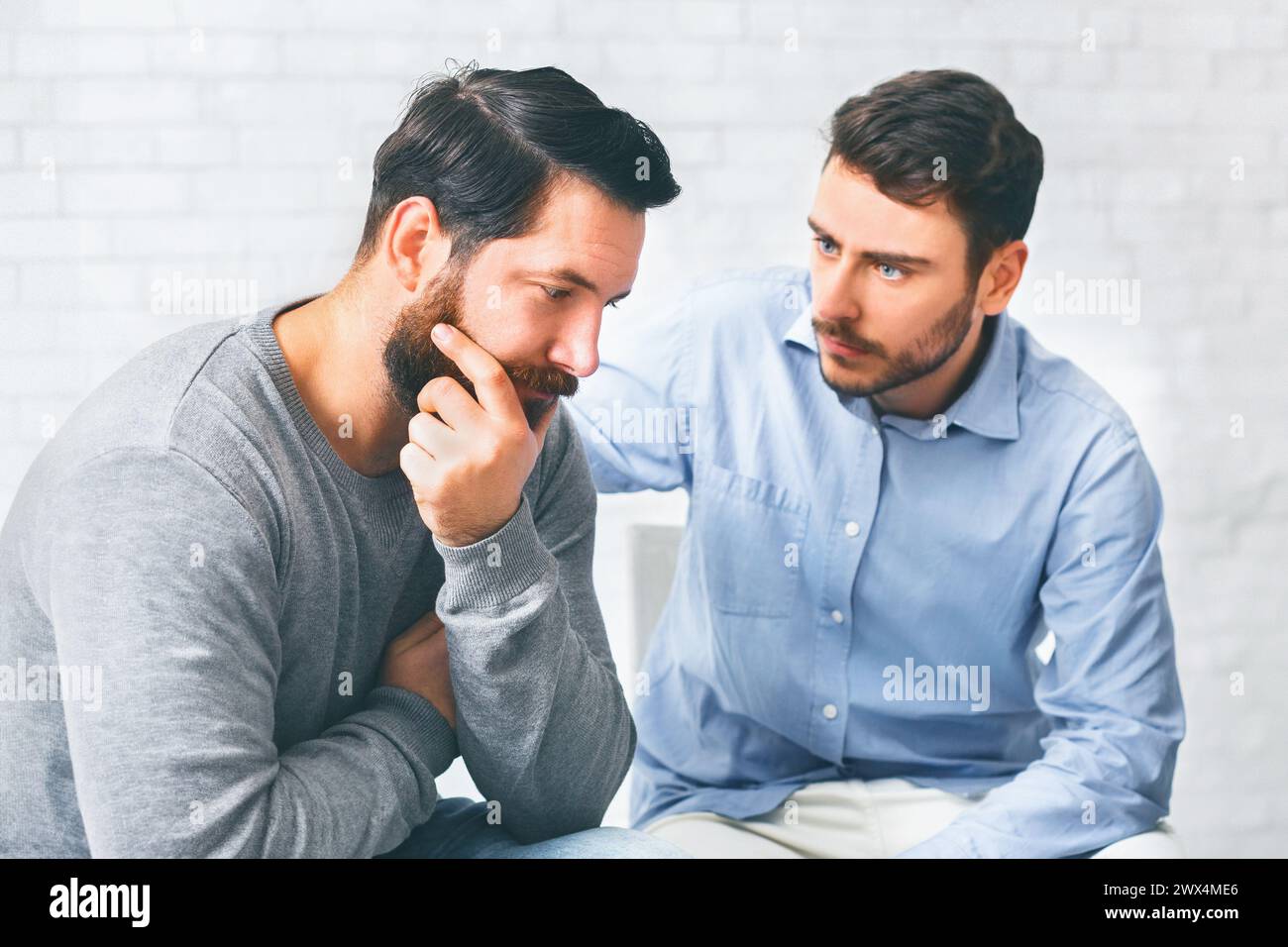 Understanding people giving support to depressed man at group therapy ...