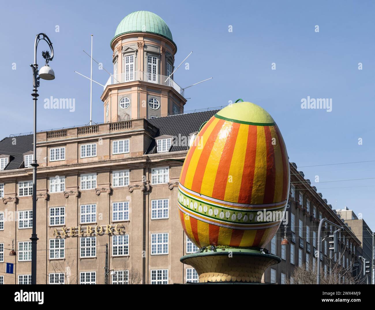 A large decorative Easter egg against a building in the city of ...