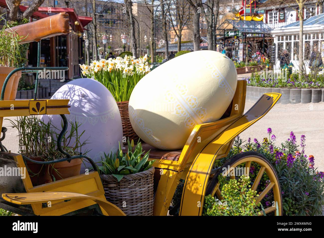 Easter decoration of a carriage with large decorative Easter eggs in a ...