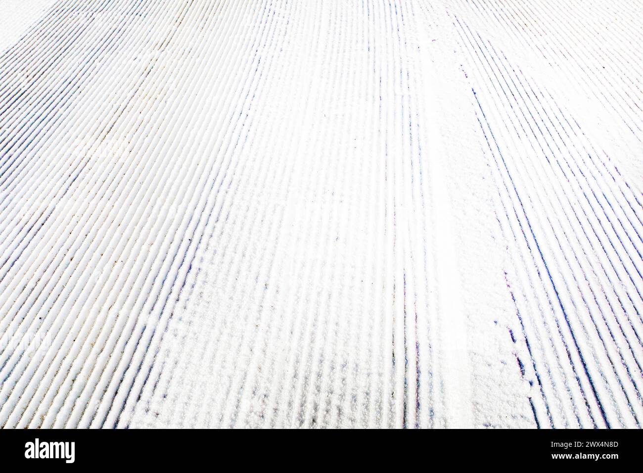 skiing and snowboarding slope closed in the early morning with traces ...