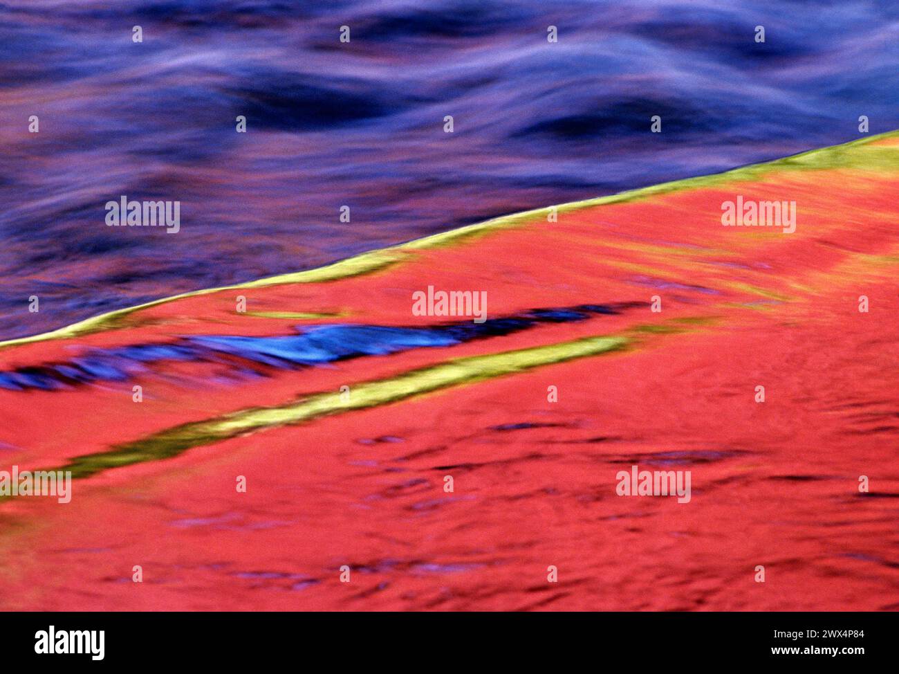 Colorful reflection of the red Pine Valley Covered Bridge in the falls ...