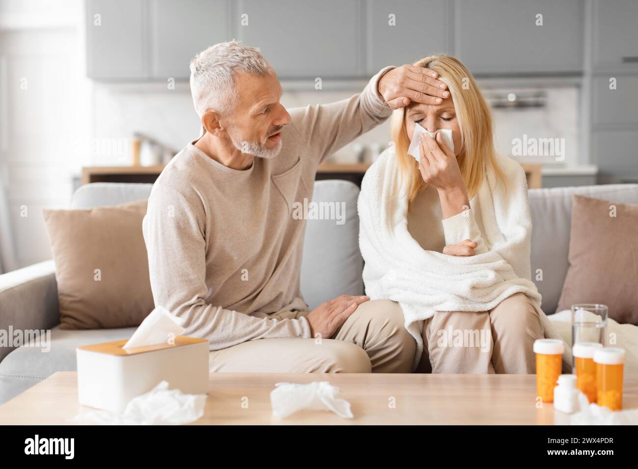 Loving husband caring sick wife hi-res stock photography and images - Alamy