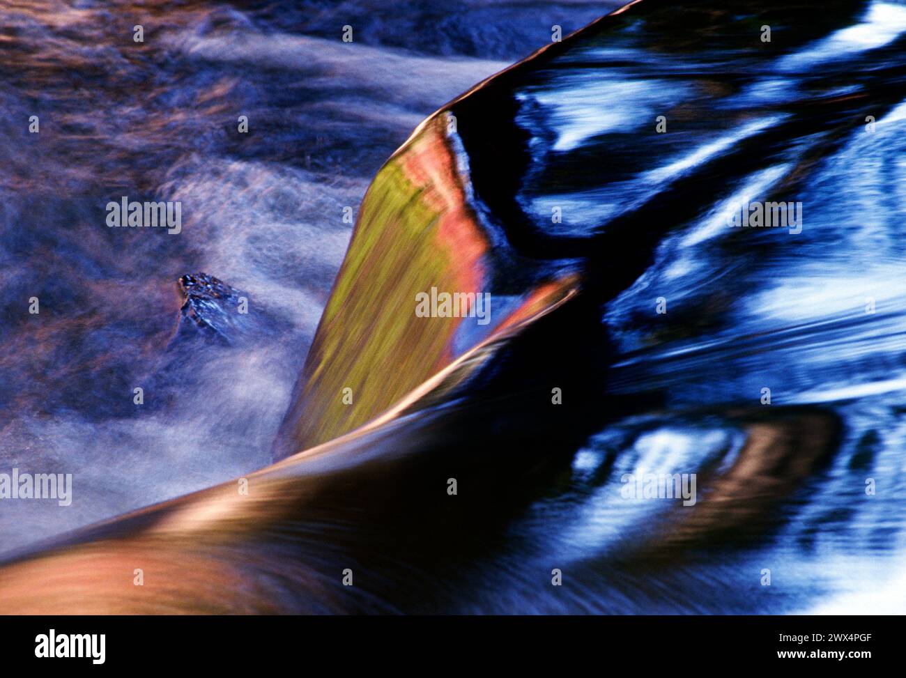 Colorful reflection of the red Pine Valley Covered Bridge in the falls ...