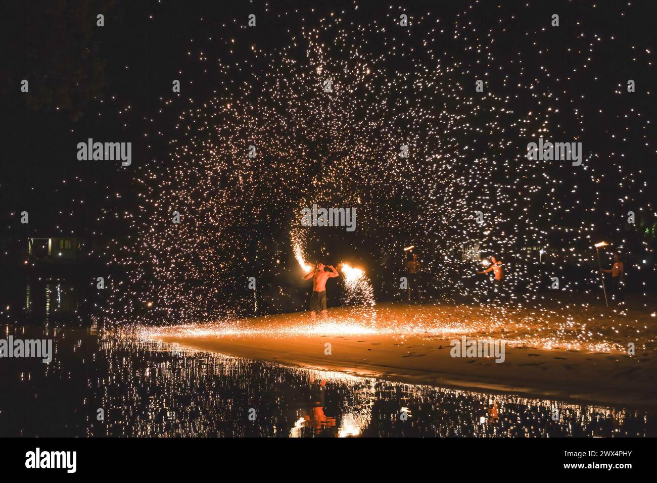 Fire show on the sandy part of a lagoon on Koh Chang Island. Fire shows ...
