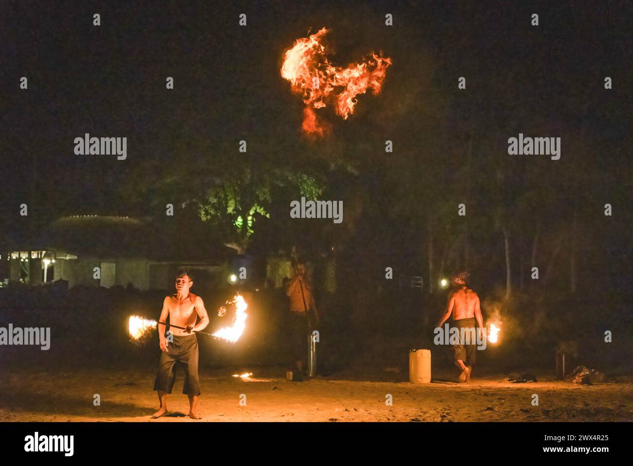 Koh Chang, Thailand. 03rd Jan, 2024. A fire dancer performs with a fire ...