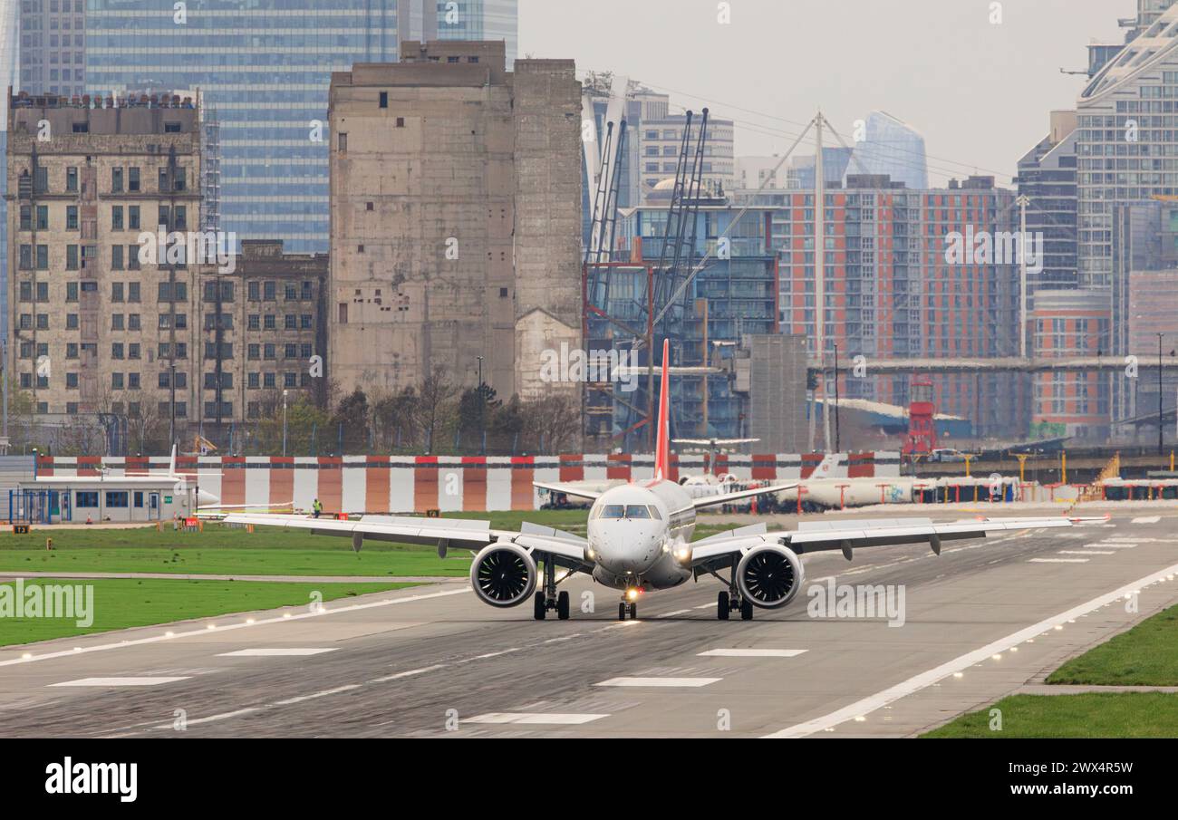 An airplane preparing for takeoff on a runway at the airport Stock ...