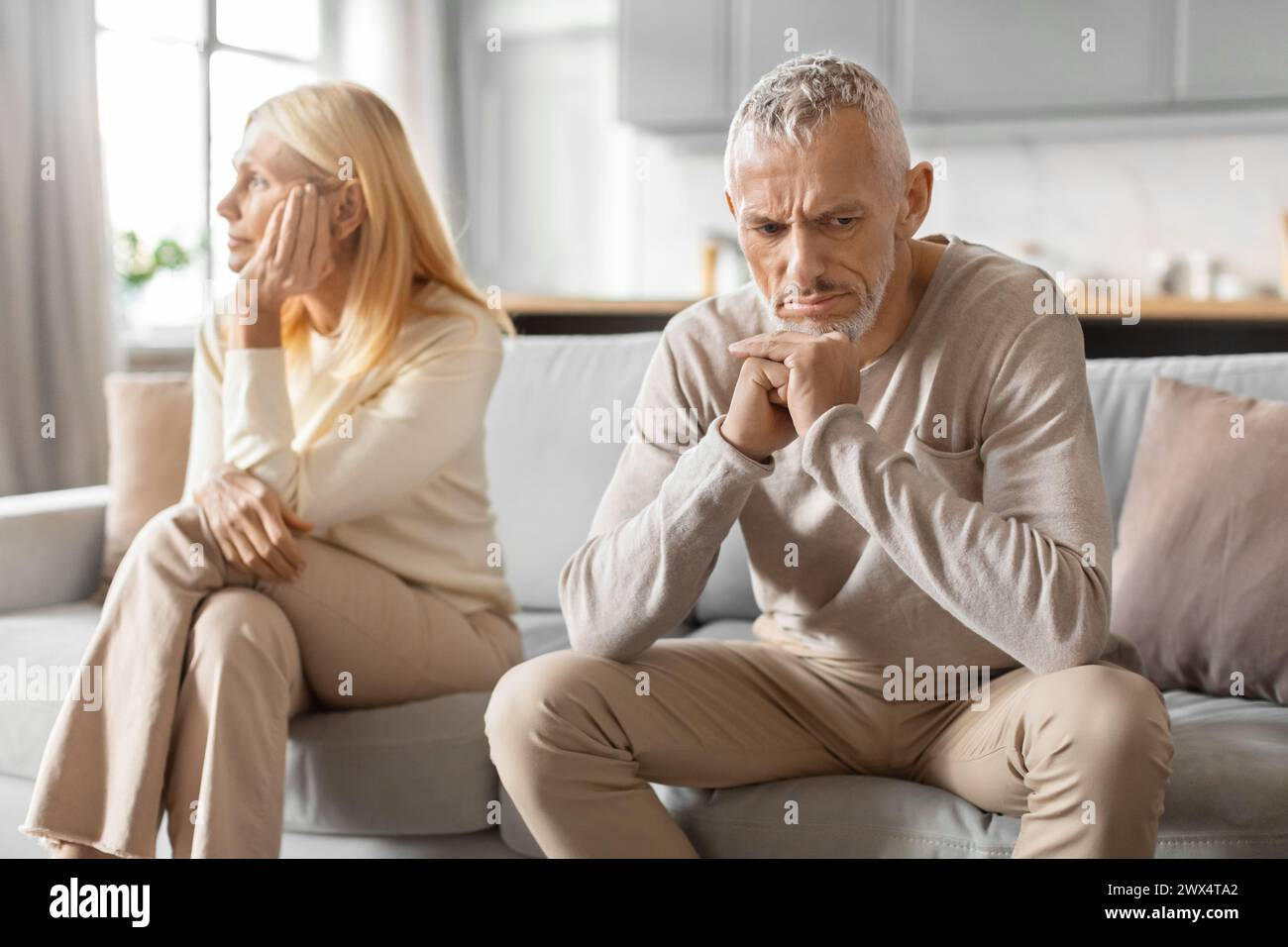 Concerned couple with man comforting woman Stock Photo - Alamy