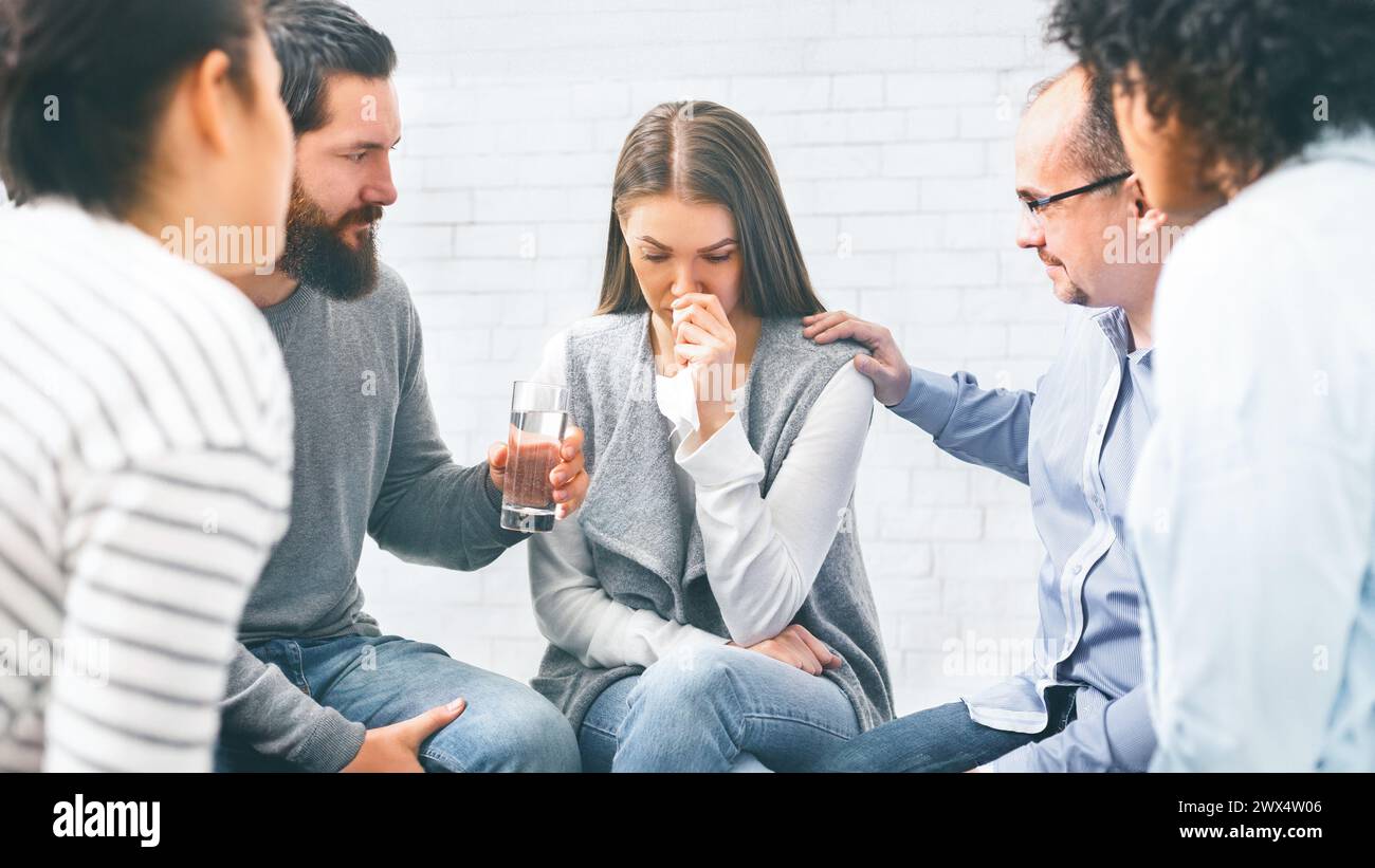 Understanding people giving support to crying woman Stock Photo - Alamy
