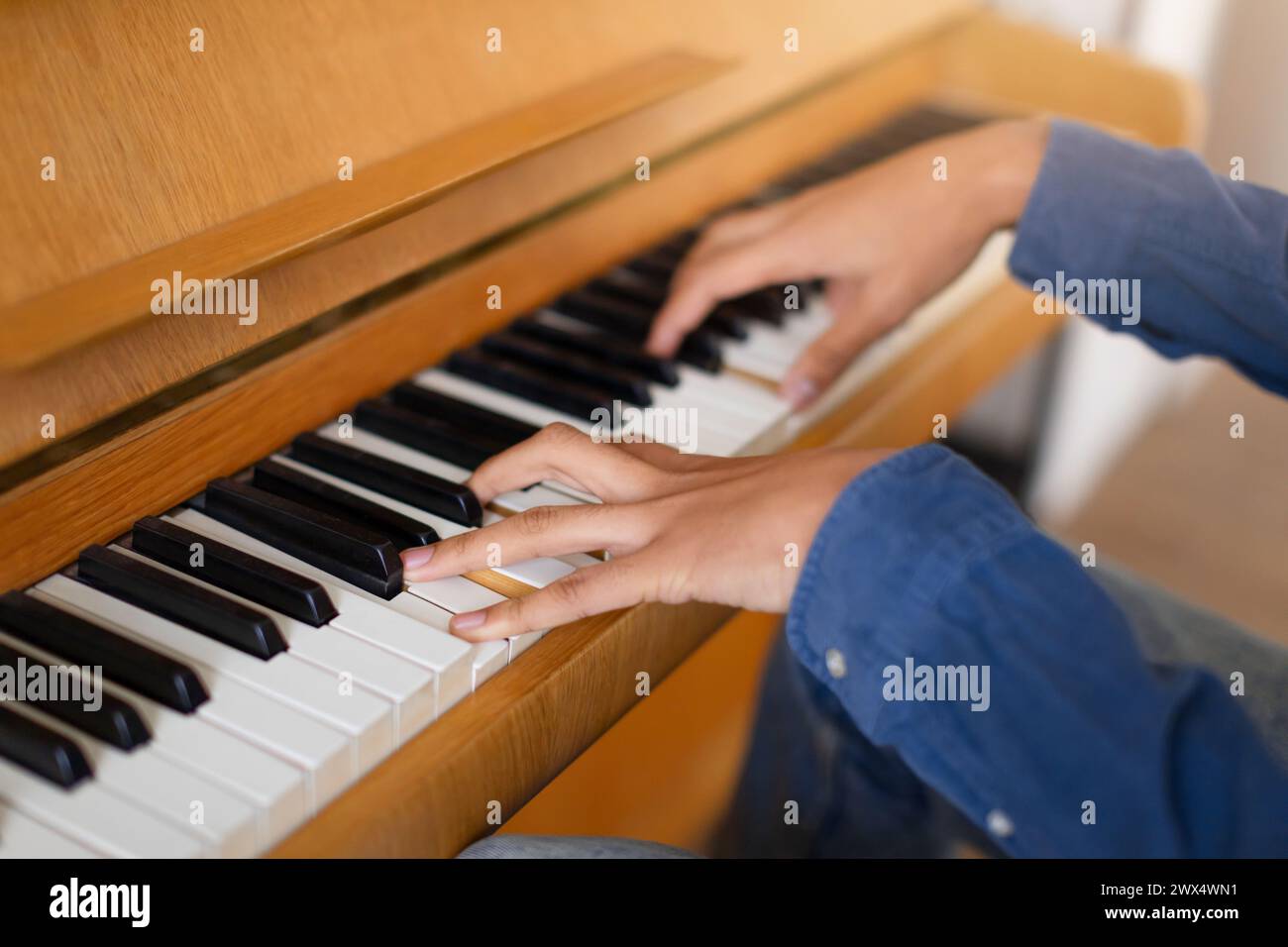 Practicing piano, focused on the keys Stock Photo - Alamy