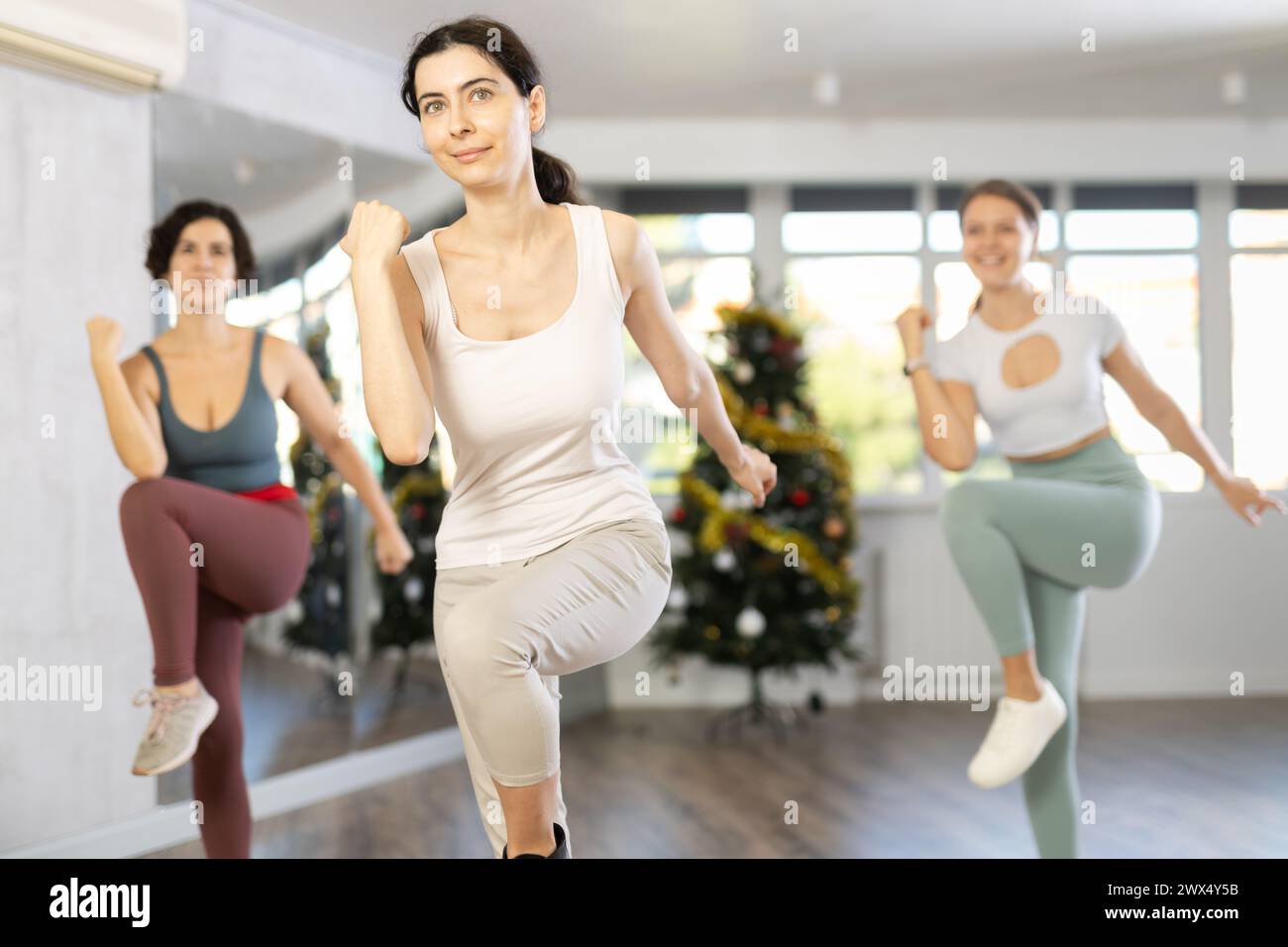 Slender young women dancers dance a twist in a modern way during ...