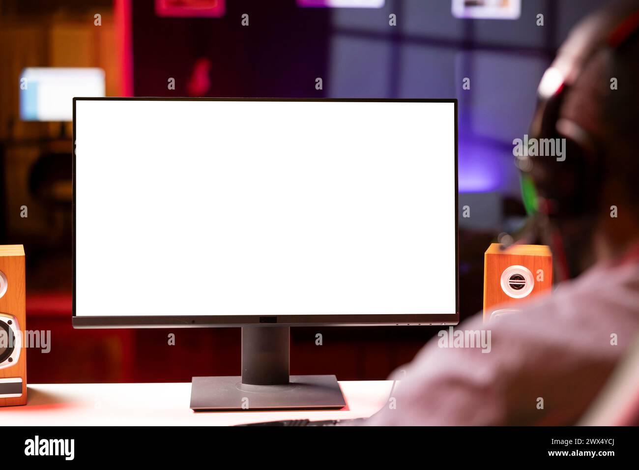 Professional streamer looking at isolated screen monitor, competing in ...