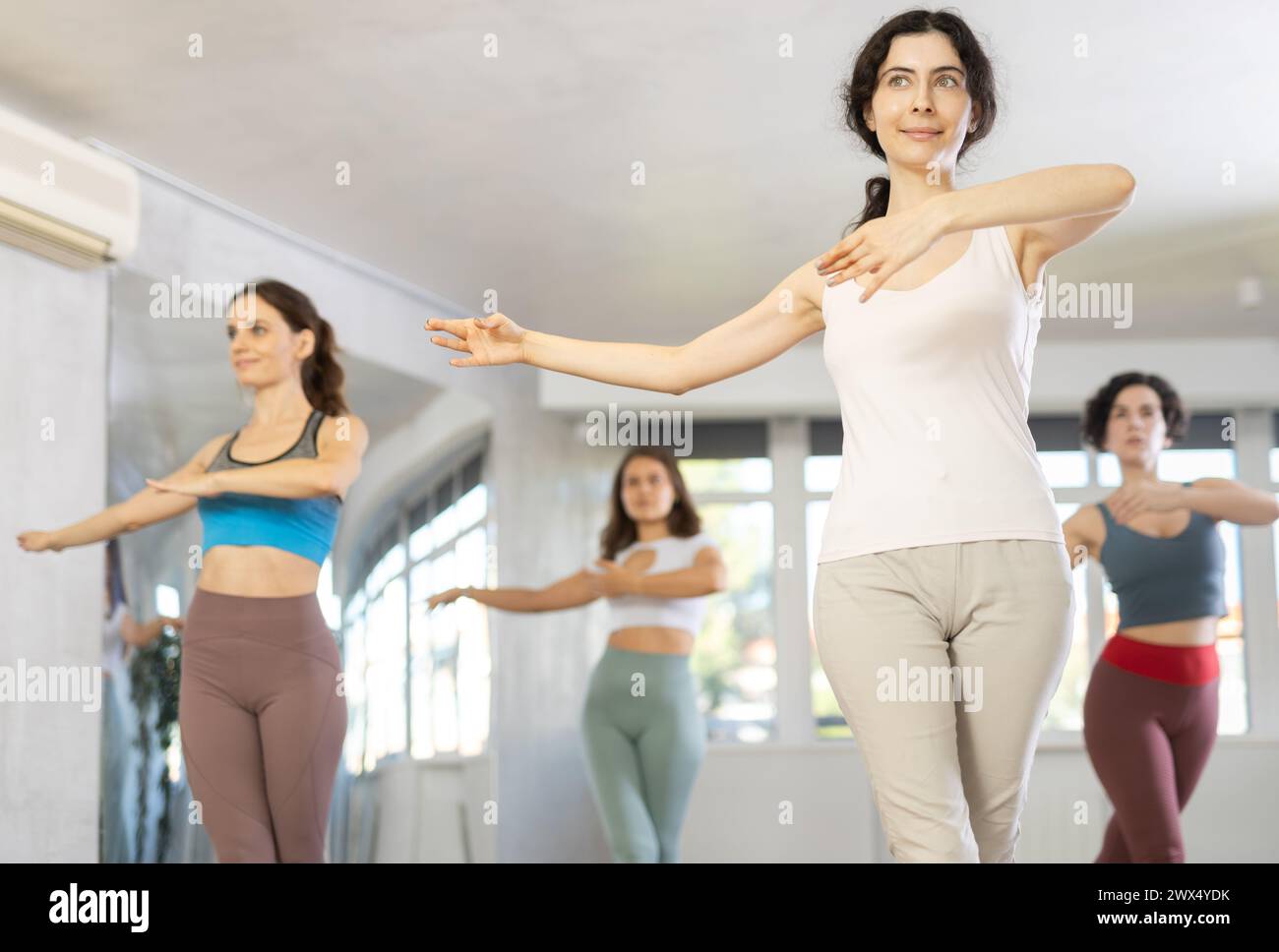 During dance lesson, girls practice and memorize movements to perform ...