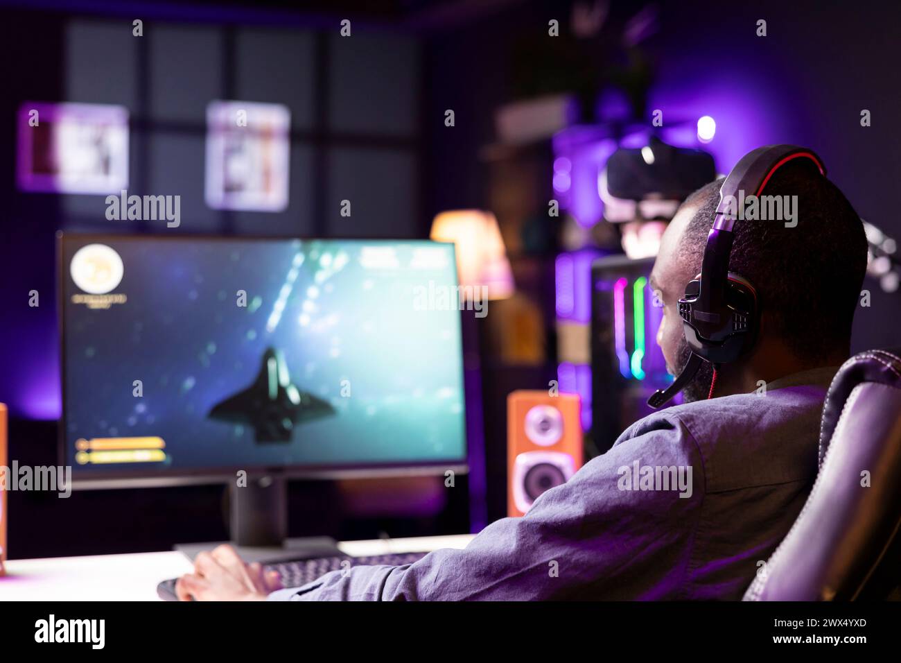 Man shoots asteroids in spaceship flying singleplayer game on gaming PC ...