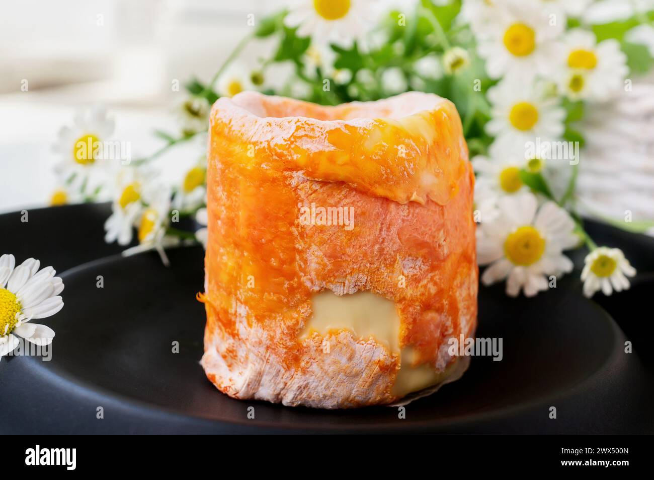 Soft cheese Langre. French soft cheese with white mold and orange rind ...