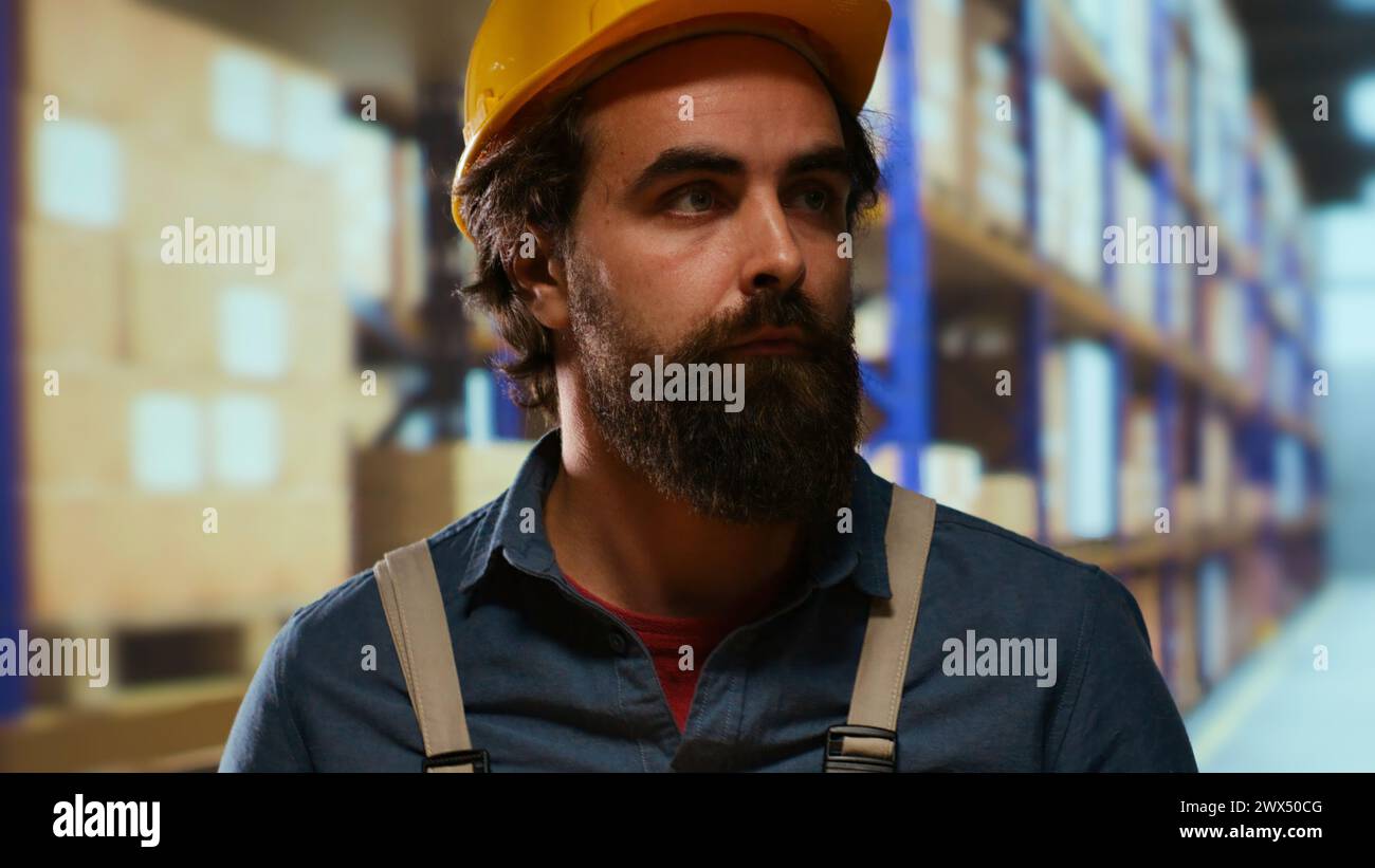 Export manager carrying packages from racks, preparing to ship orders ...