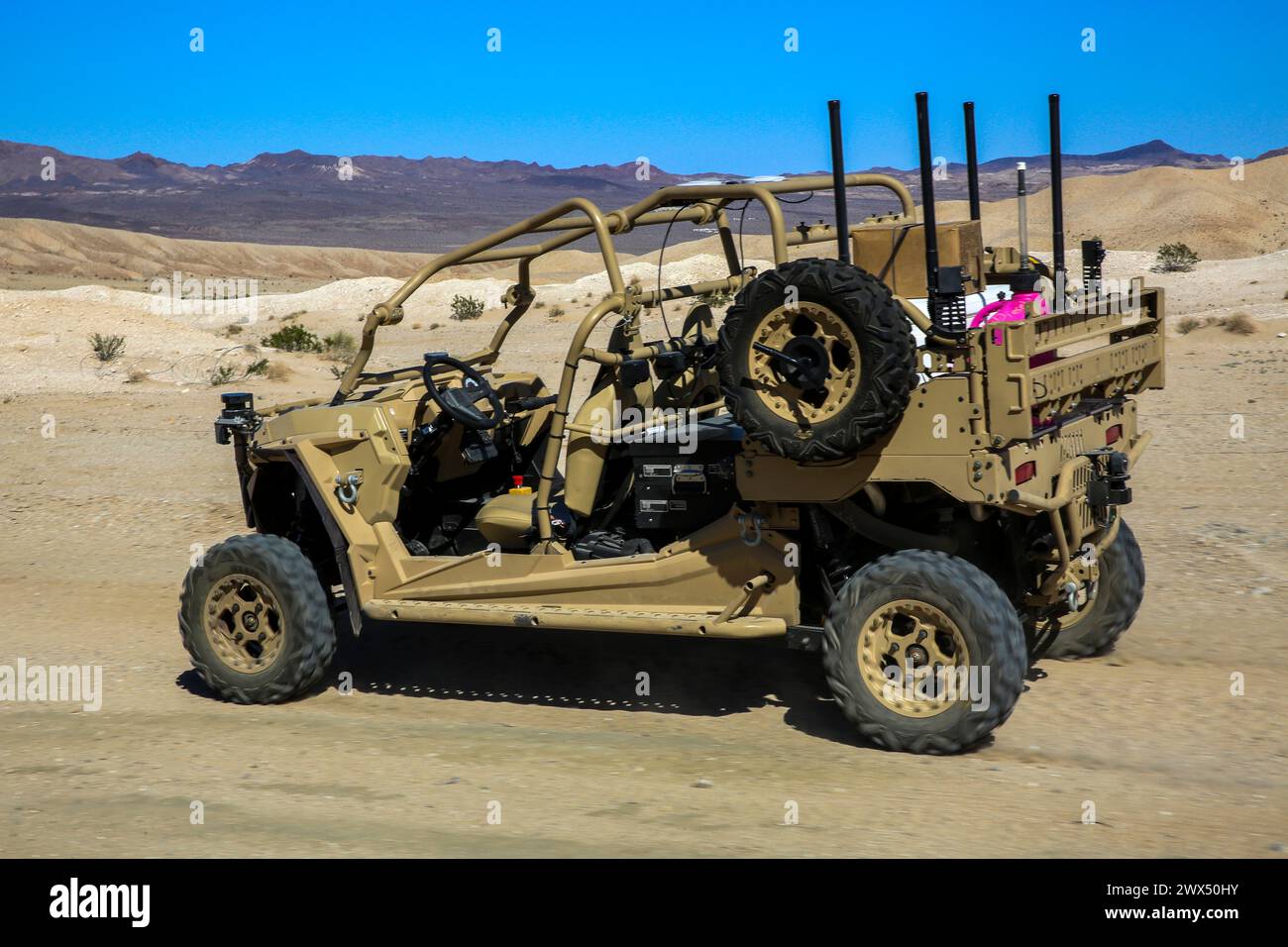 An unmanned MRZR, known as the M-razor, light tactical vehicle cruises ...