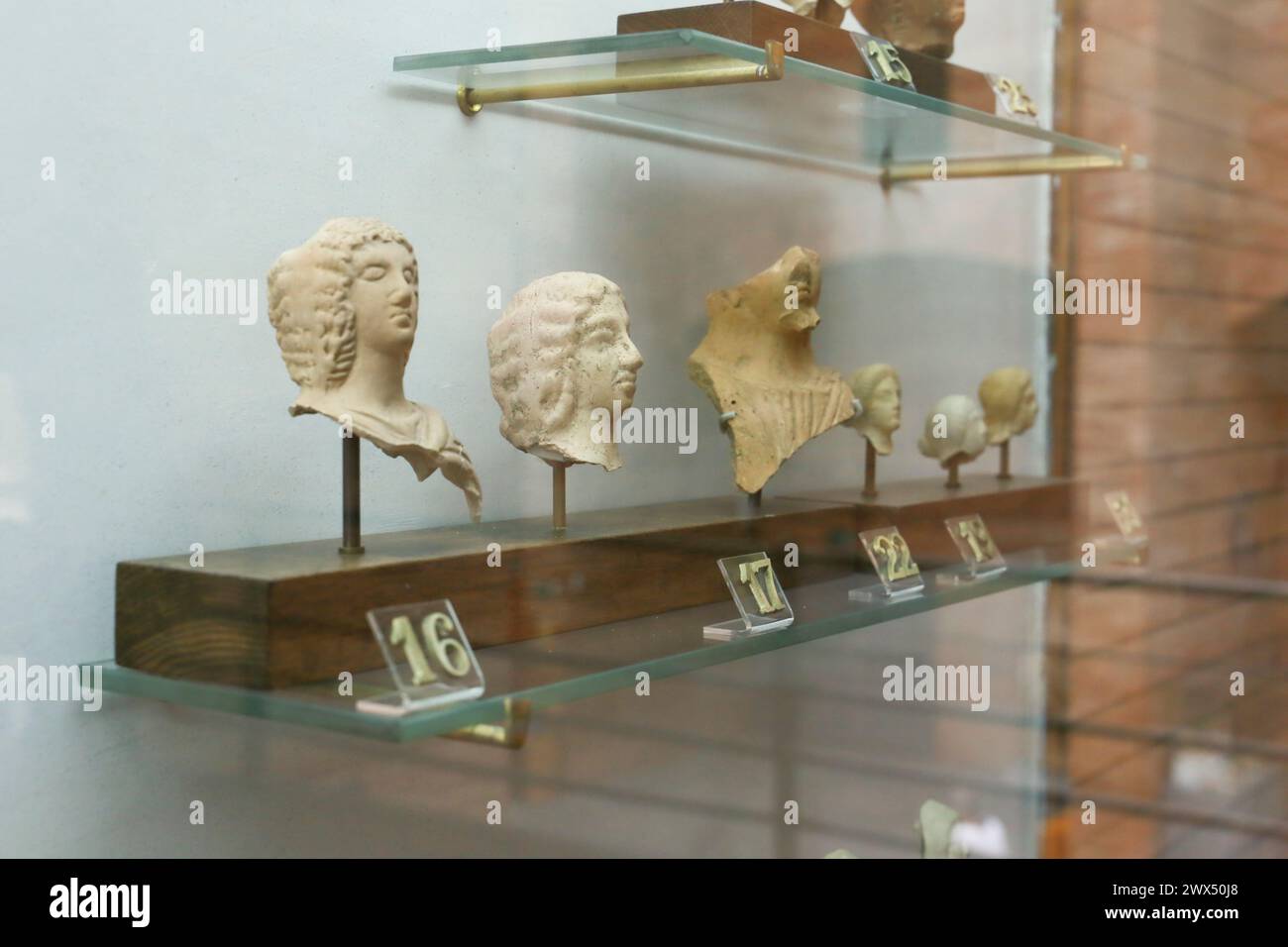 Merida, Extremadura, Spain- October 23, 2023: Stone female heads with ...