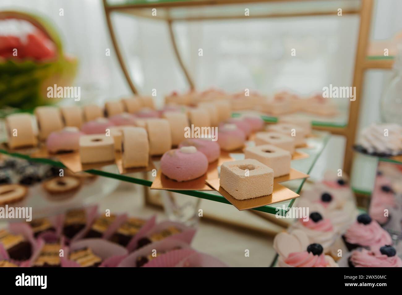 Sweet cakes at a wedding banquet. Catering, sweet festive buffet. Cookies, chocolate bar Stock ...