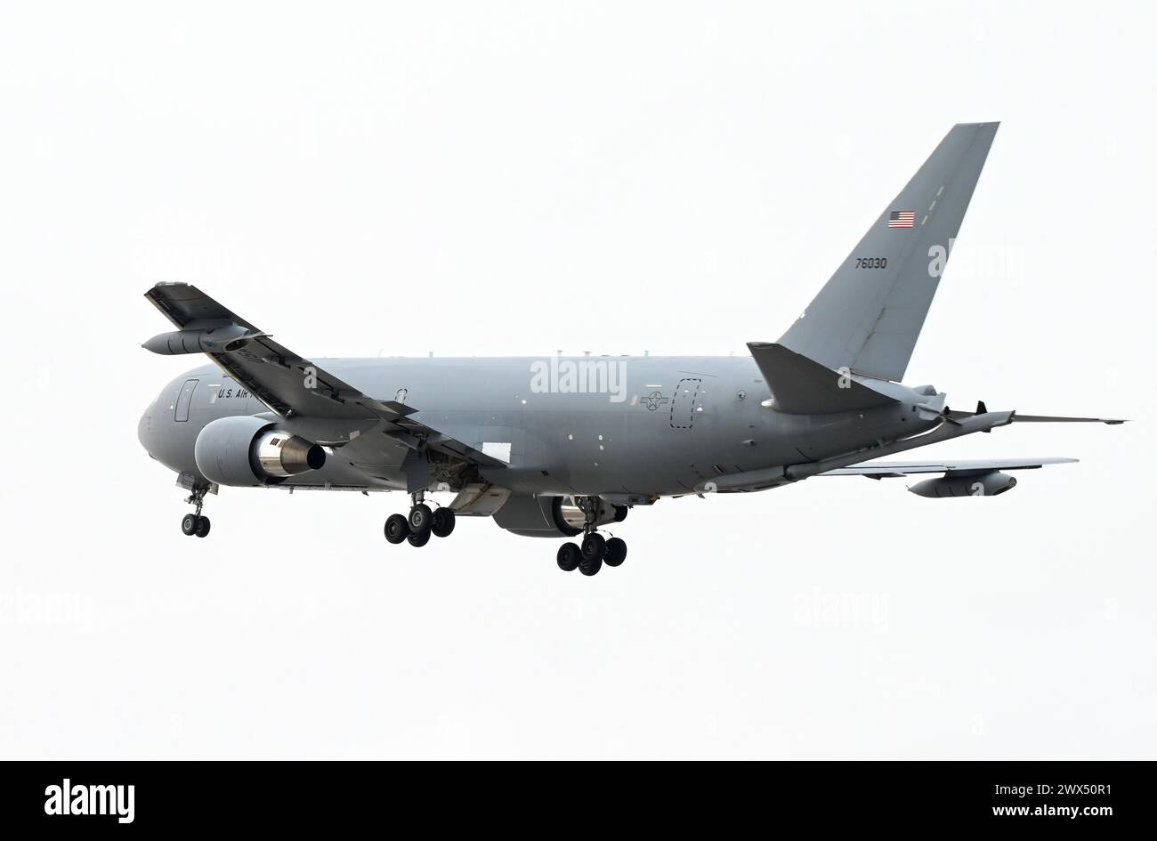 A KC-46A Pegasus with Wing Aerial Refueling Pods attached takes off ...