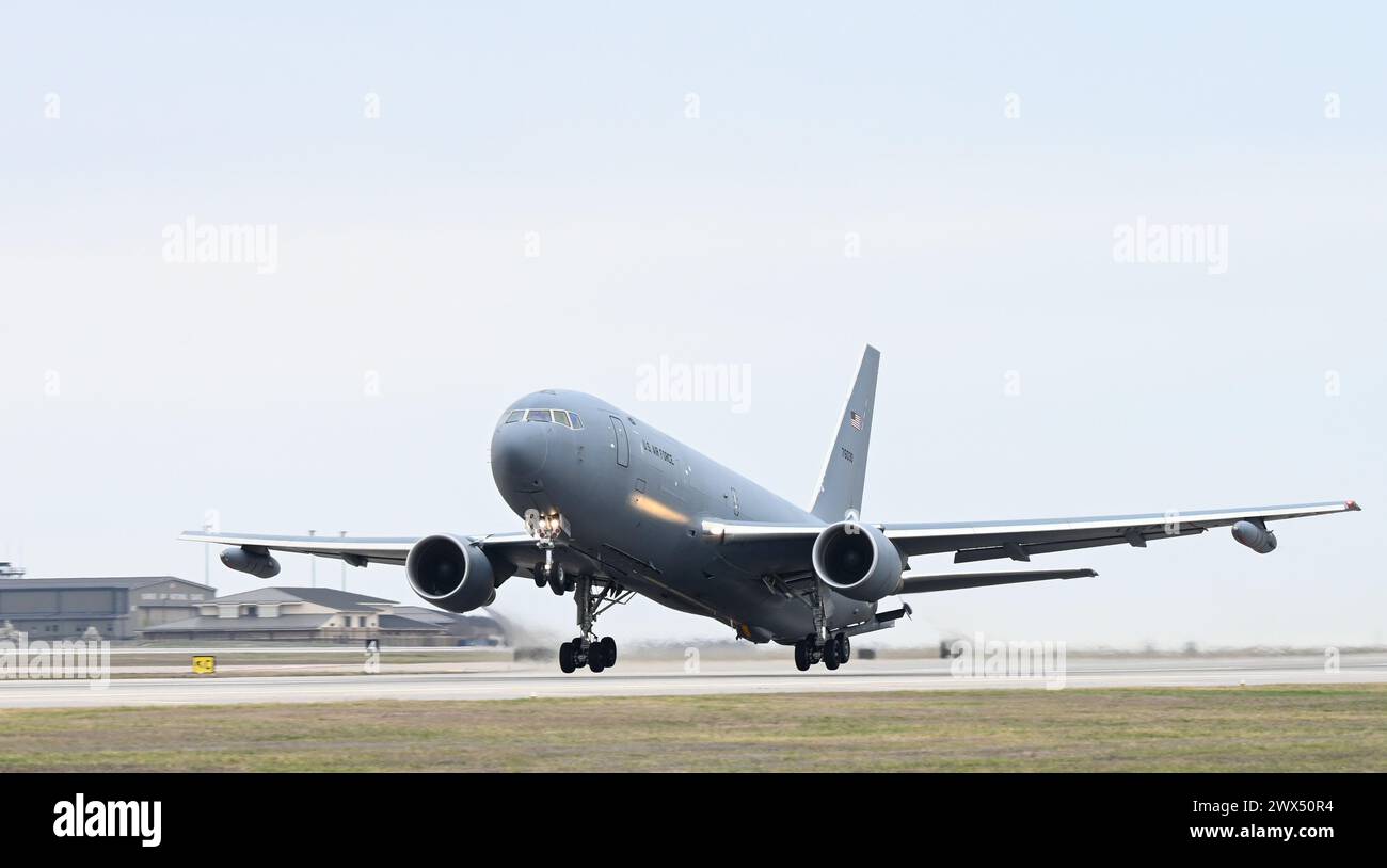 A KC-46A Pegasus with Wing Aerial Refueling Pods attached takes off ...