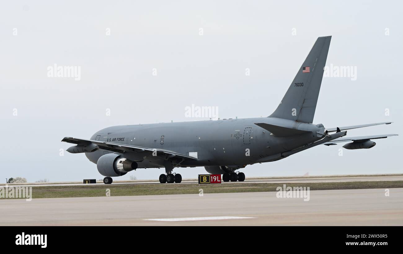 A KC-46A Pegasus with Wing Aerial Refueling Pods attached taxis toward ...