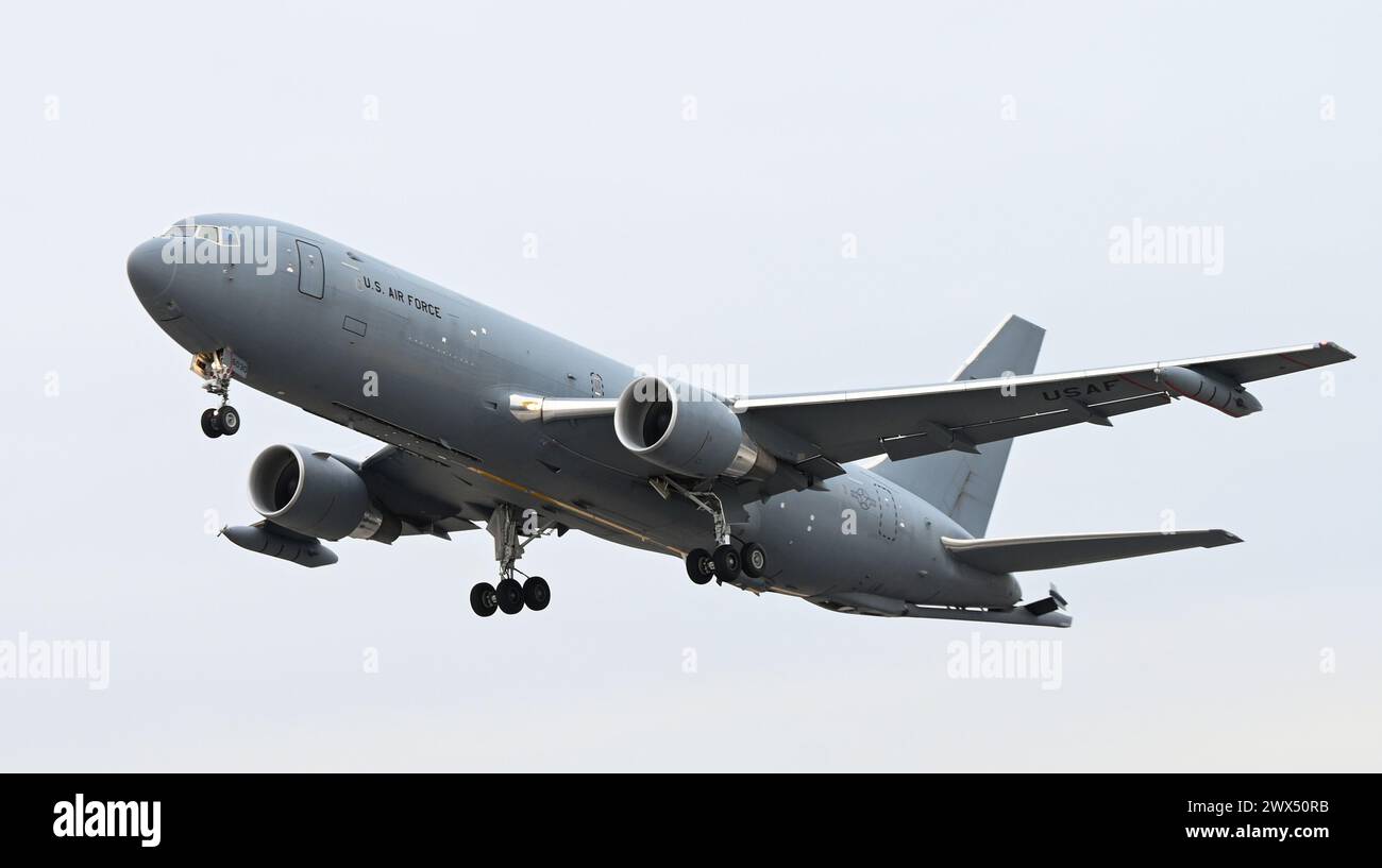 A KC-46A Pegasus with Wing Aerial Refueling Pods attached takes off ...