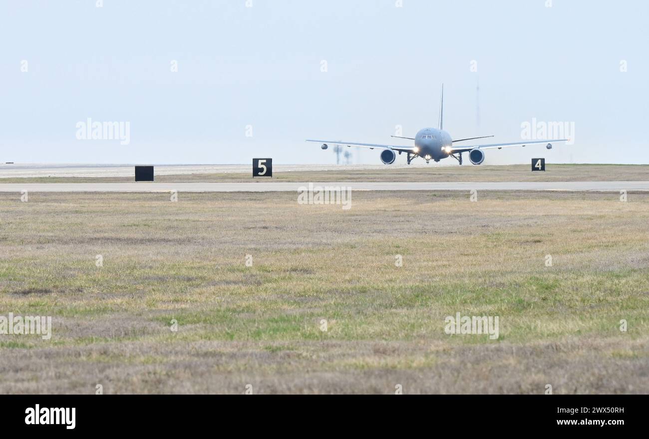 A KC-46A Pegasus with Wing Aerial Refueling Pods attached takes off ...