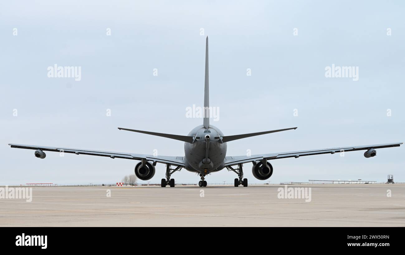 A KC-46A Pegasus with Wing Aerial Refueling Pods attached taxis toward ...