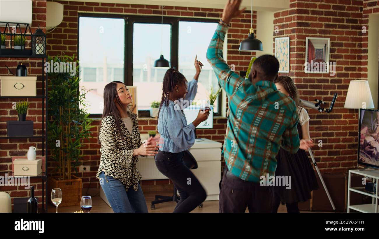 Group cheerful friends jumping dancing hi-res stock photography and ...