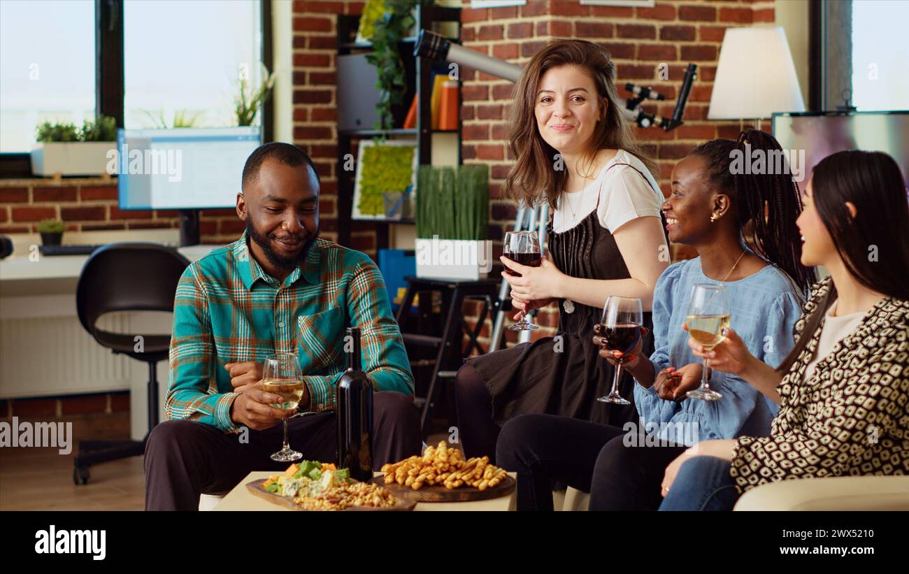 Portrait of happy friends having entertaining conversation, eating ...