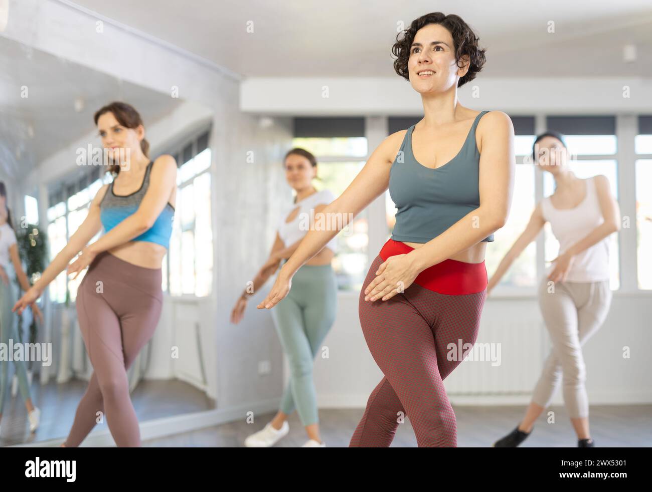 Group of women dancing modern dance in studio Stock Photo - Alamy