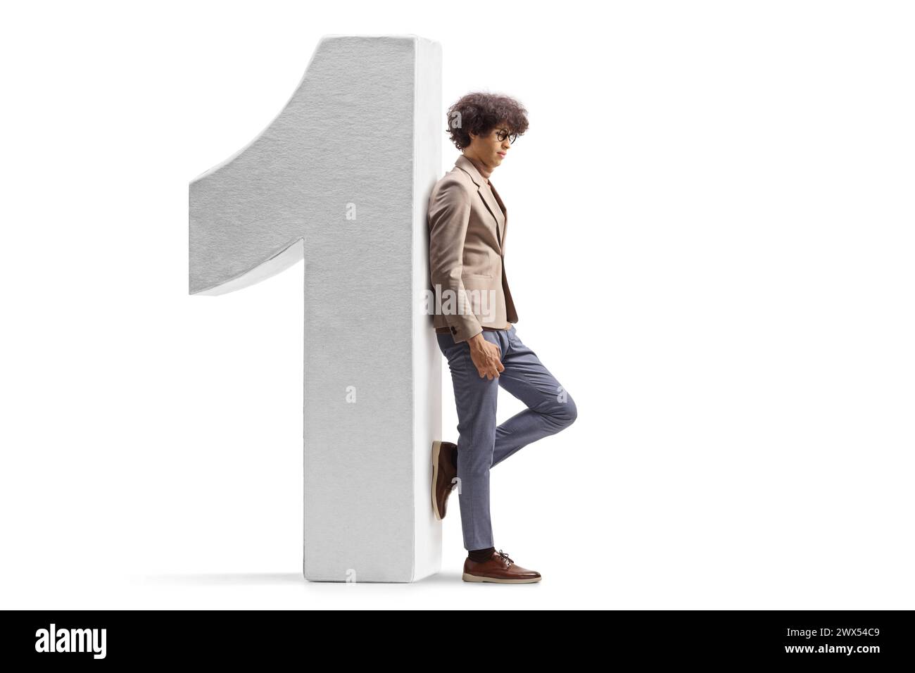 Young man leaning on number one and looking down isolated on white ...