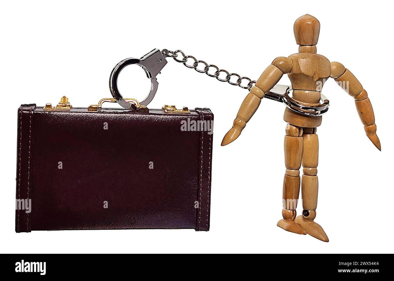 Shackled to his briefcase to show he's shackled to the office Stock ...