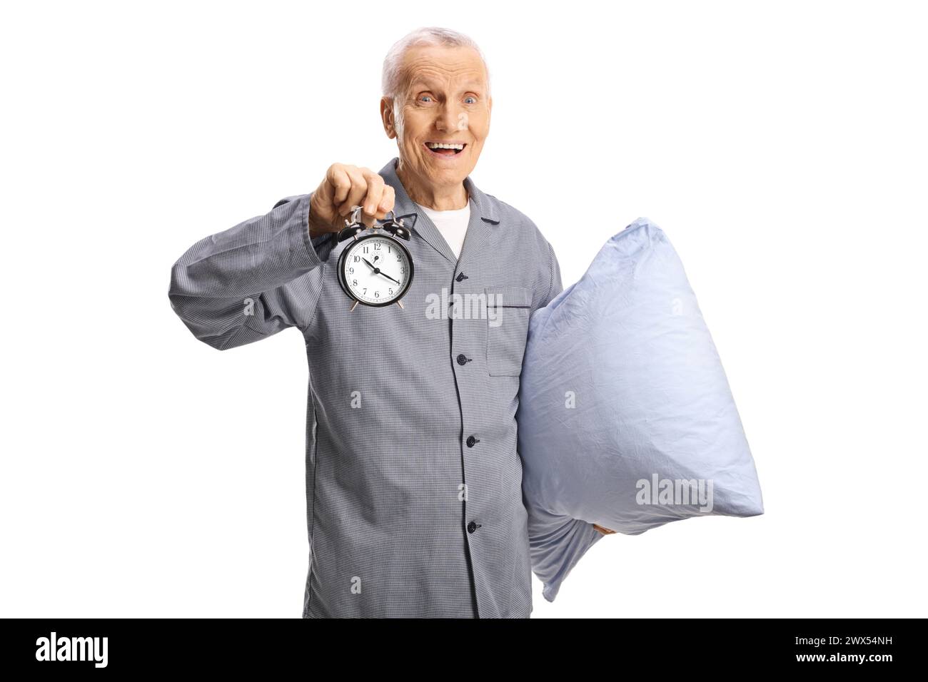 Elderly man in pajamas holding a pillow and an alarm clock isolated on ...
