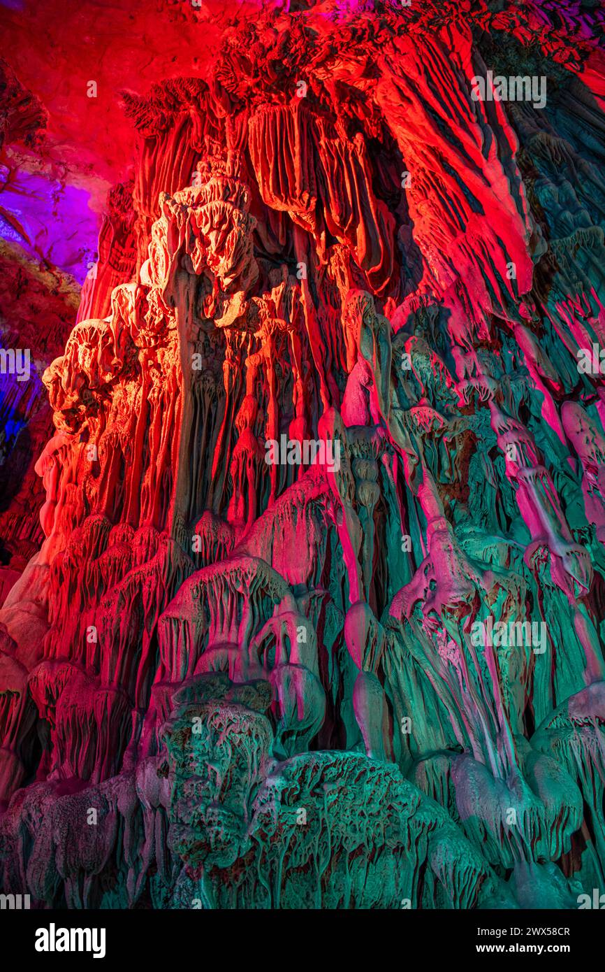 Beautiful illuminated multicolored stalactites from karst Reed Flute ...