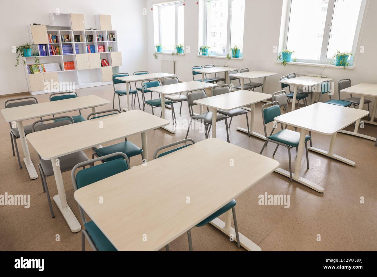 Empty school classroom with desks, windows and chairs Stock Photo - Alamy