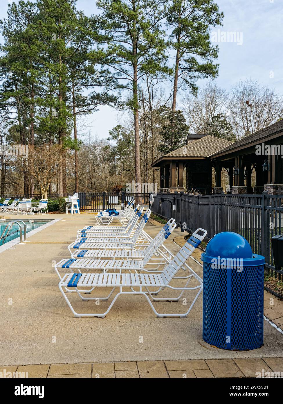 Pool deck with lounge chairs lined up waiting for summer crowds at a ...