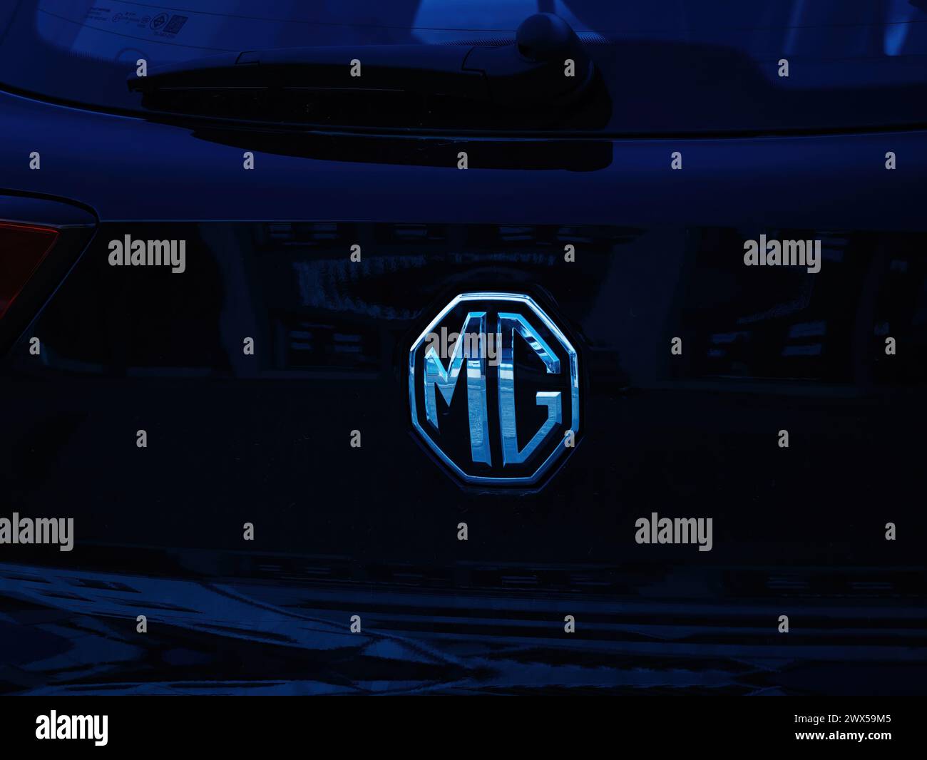 Haguenau, France - Mar 20, 2024: The MG car logo, in chrome, adorns a ...