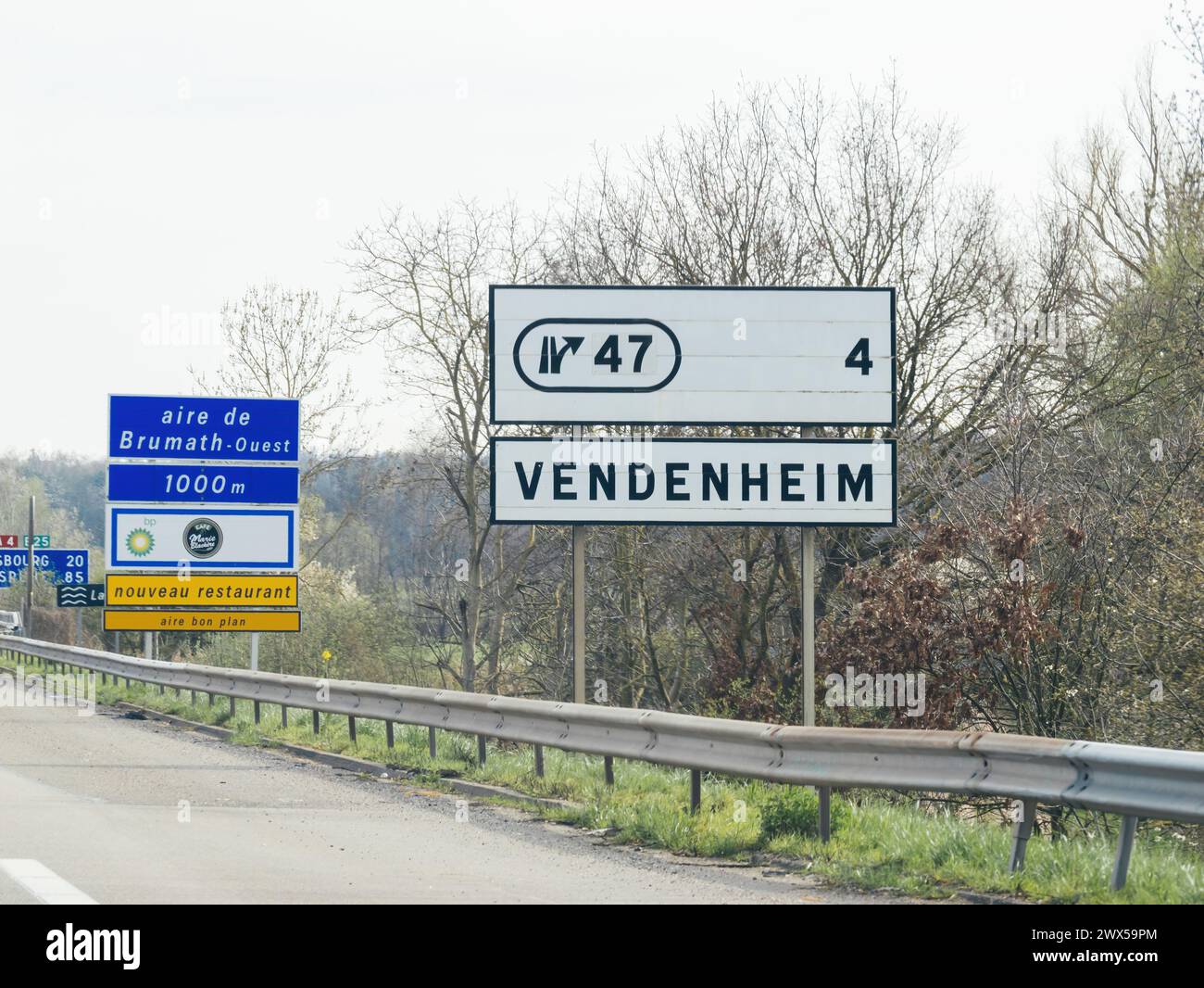 A highway sign positioned on the side of the road, providing essential ...