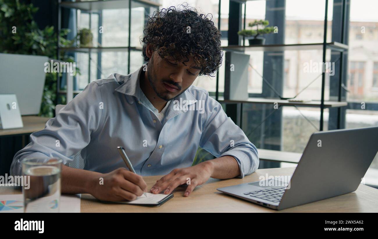 Focused businessman business person accountant office worker writing ...