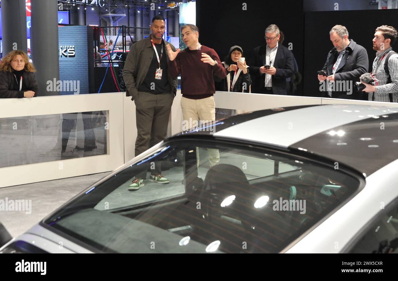 New York, USA. 27th Mar, 2024. Goran Turkic (R) explains the 2024 ...