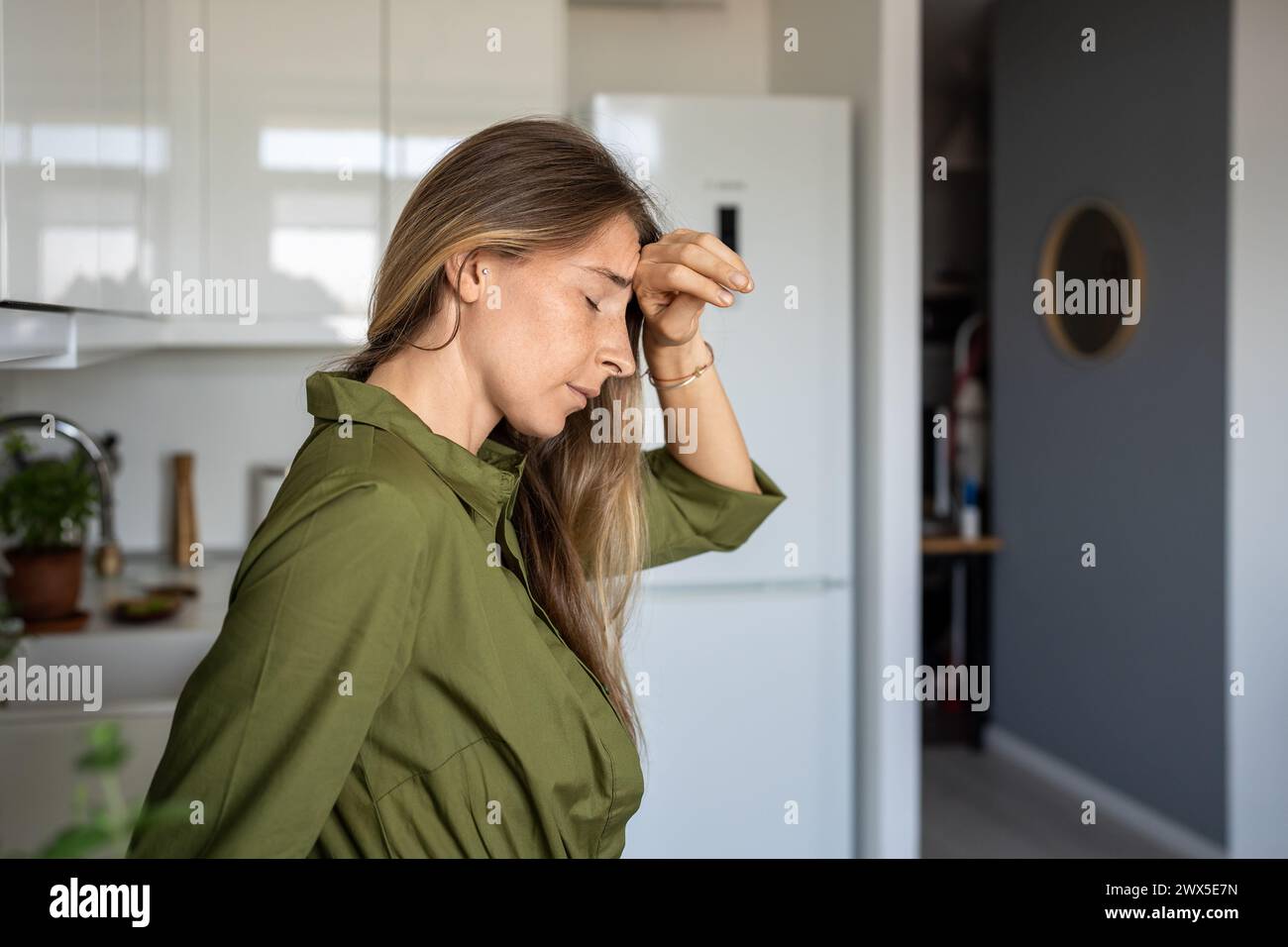 Tired unwell exhausted middle aged woman feeling headache migraine ...