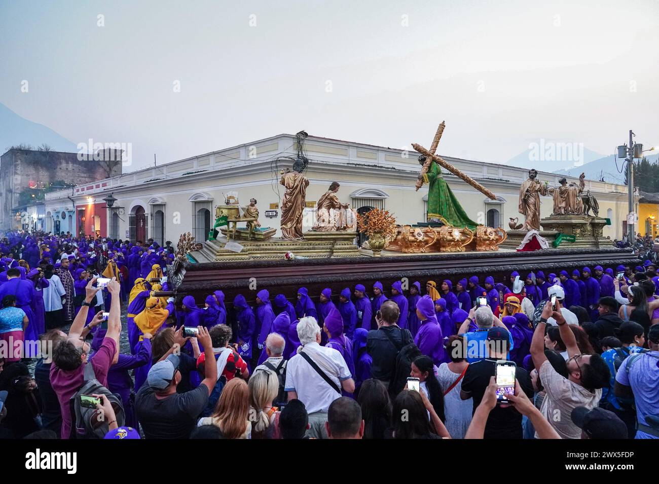Antigua, Guatemala. 27th Mar, 2024. Costaleros carry the massive Jesús ...